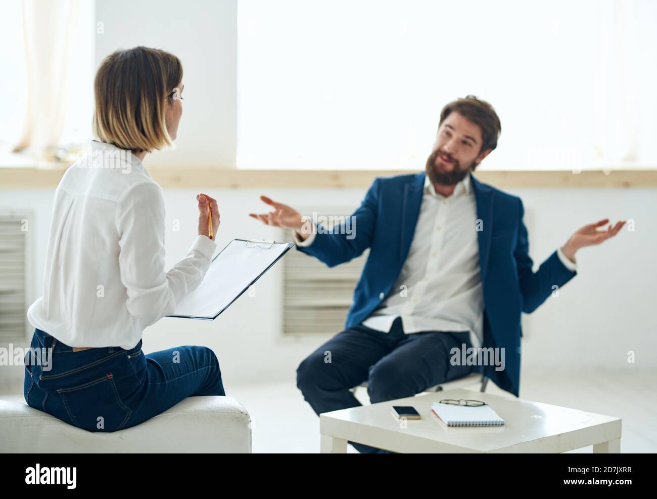 A man at the reception of a psychologist communication consultation ...