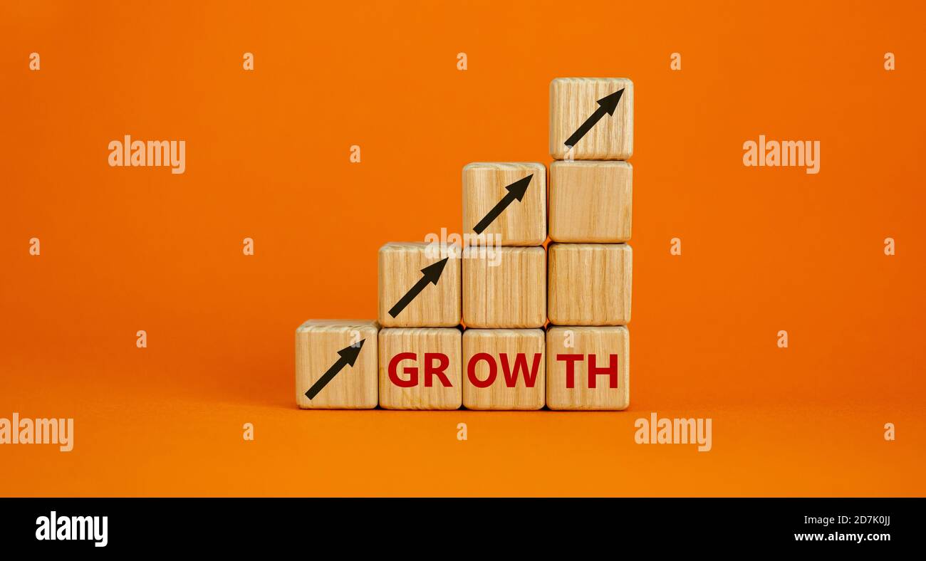 Growth or business concept. Arrow icon and word 'growth' on wooden ...
