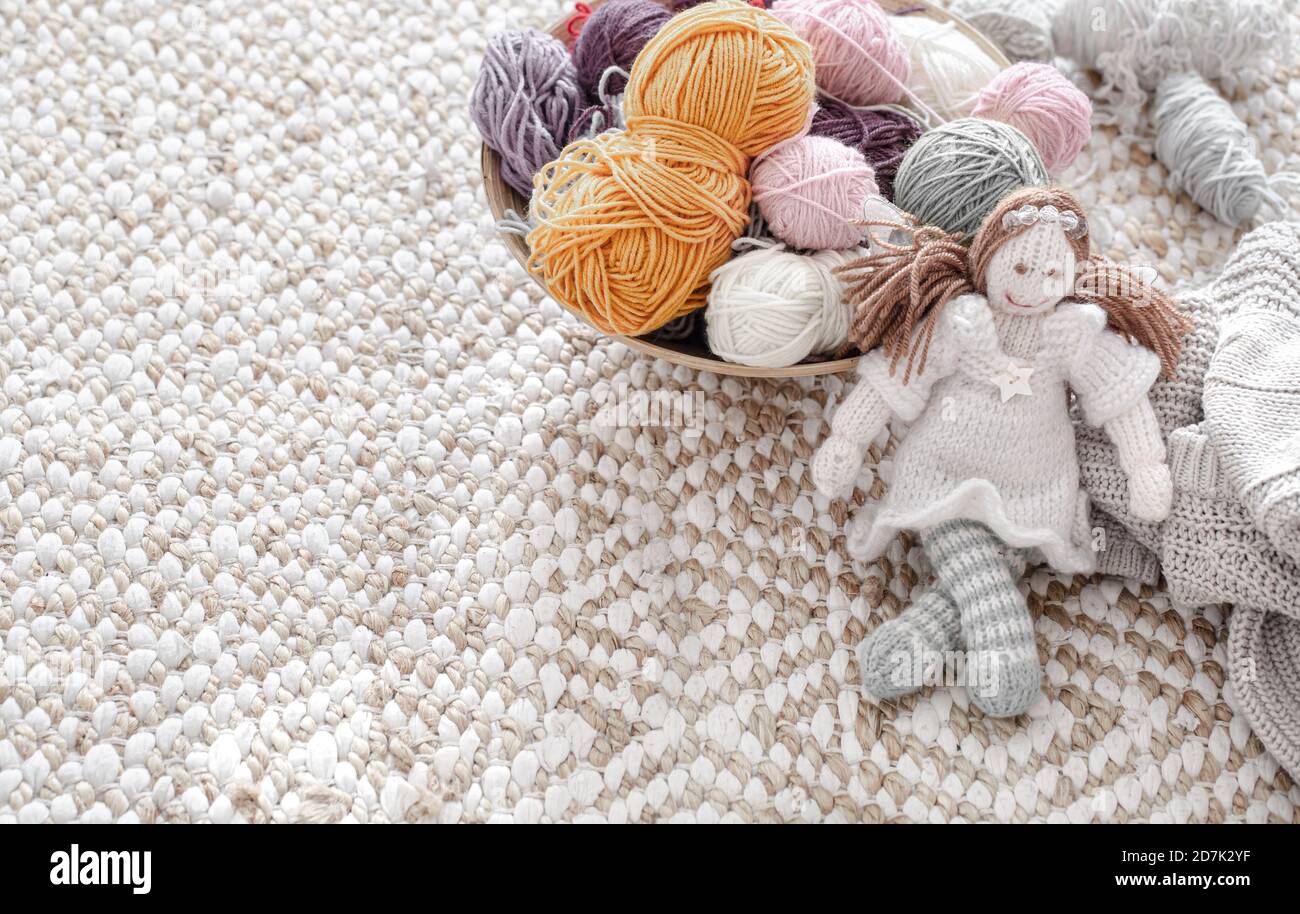 Handmade knitted toys with balls of thread . Concept of Hobbies and ...