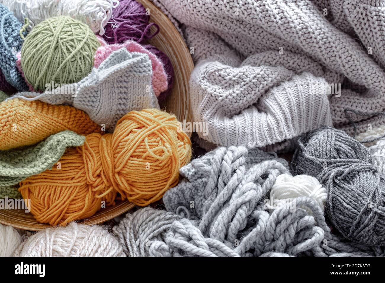 Different yarn for knitting in pastel and bright colors. Close- up ...