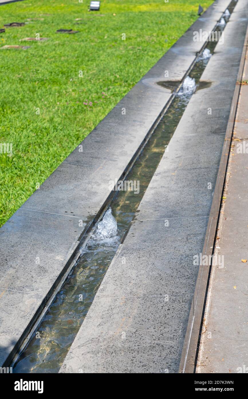 Long Fountain With Water Flow in Park Stock Photo - Alamy