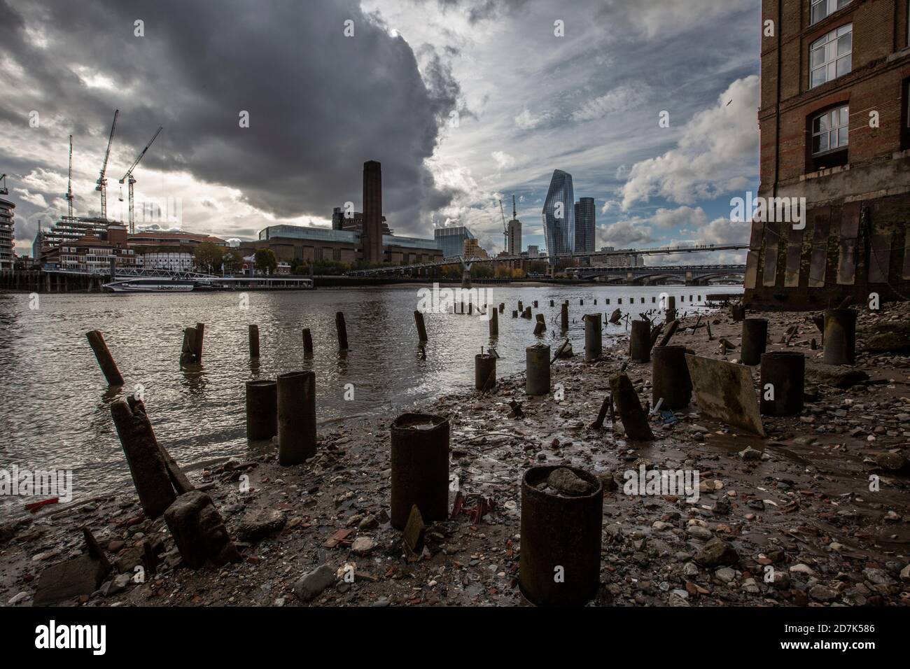 View along the Thames River bank from the foreshore during low tide ...