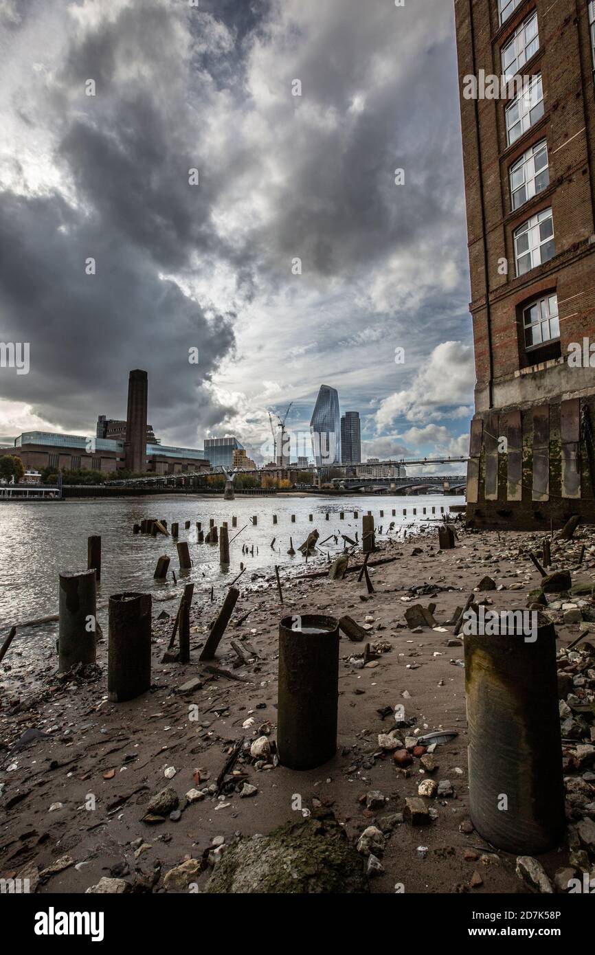 View along the Thames River bank from the foreshore during low tide ...