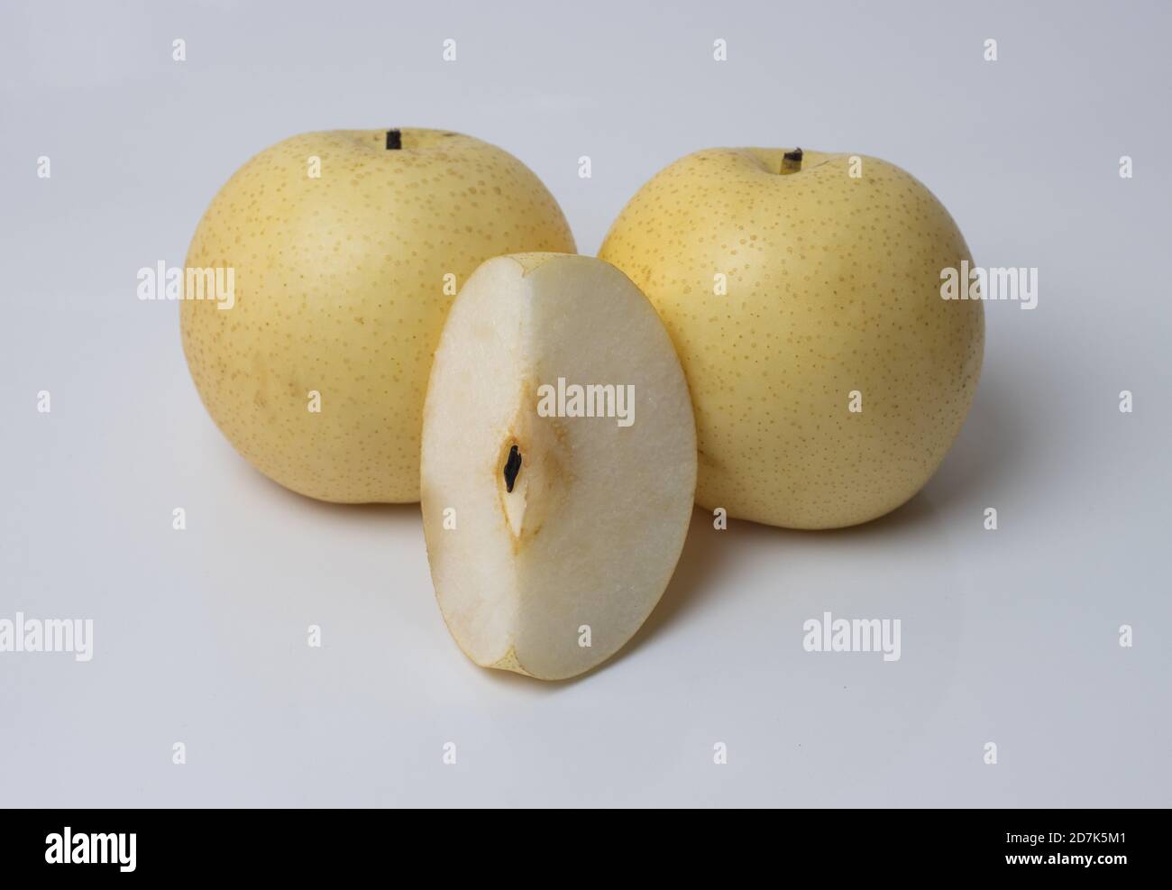 Isolated two and half of yellow pear fruits on white background Stock ...