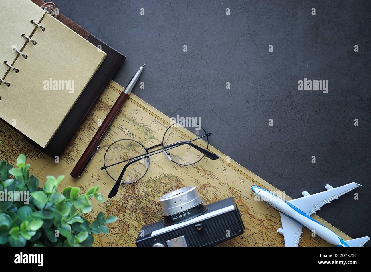 Travel concept. Map on the table andl aircraft Stock Photo - Alamy
