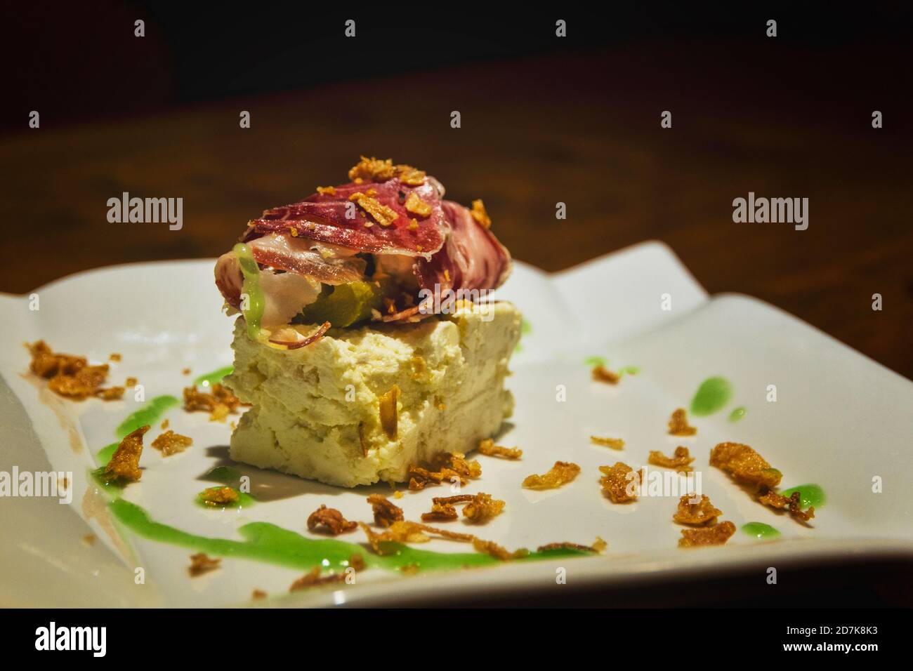 Detail of bar food skewer on wooden table with ham Stock Photo - Alamy