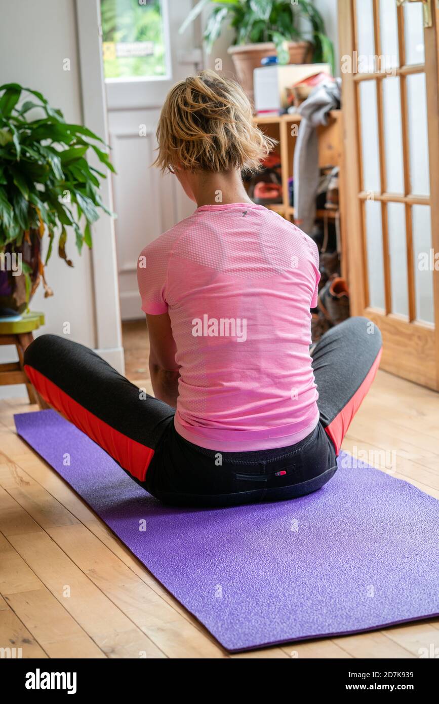 Woman doing yoga at home Stock Photo - Alamy