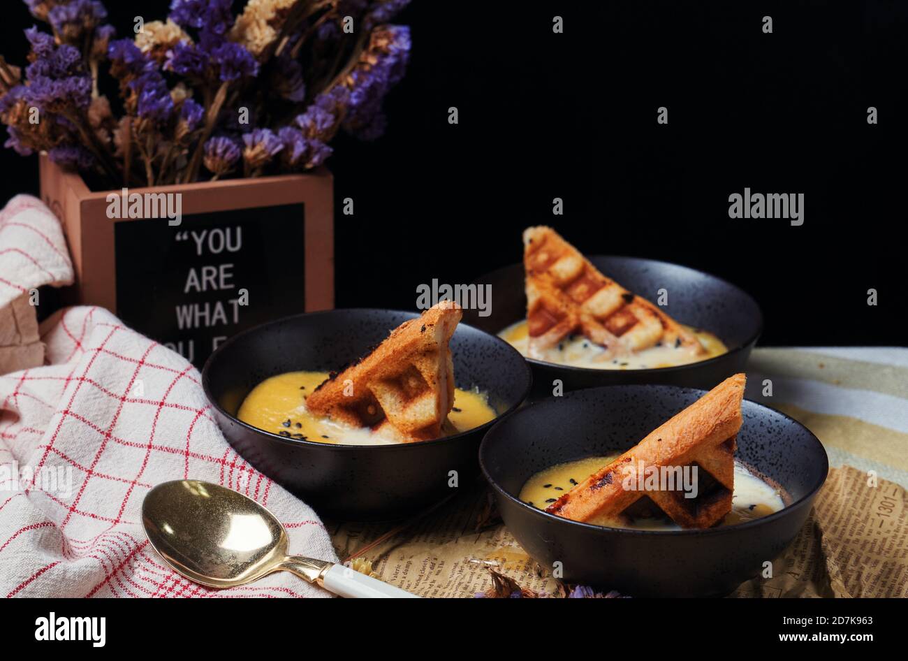 Waffle dips in soup serving by the slogan You Are What You Eat Stock ...