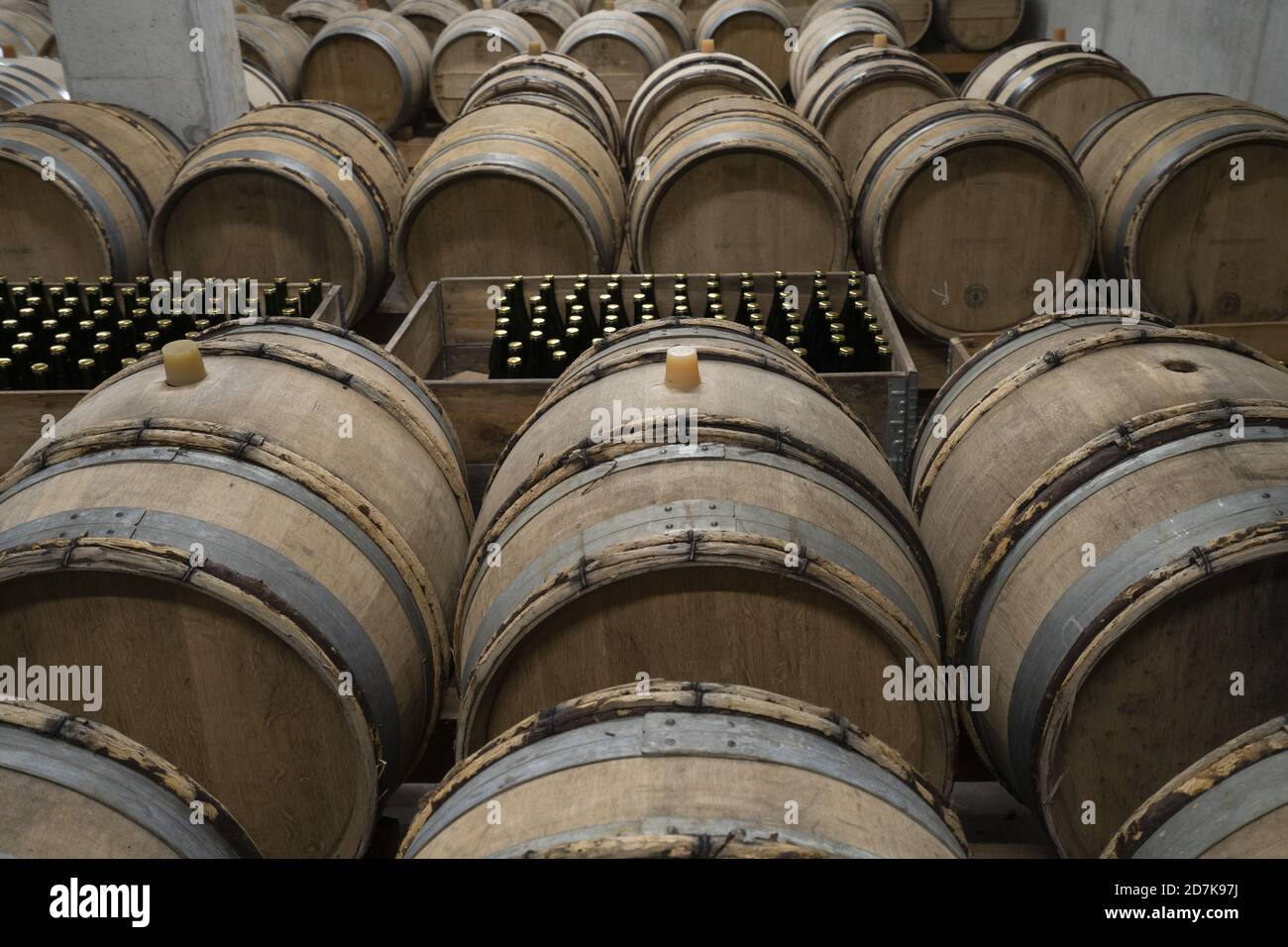 Stack of wooden barrels, old French luxury winery display in estate ...
