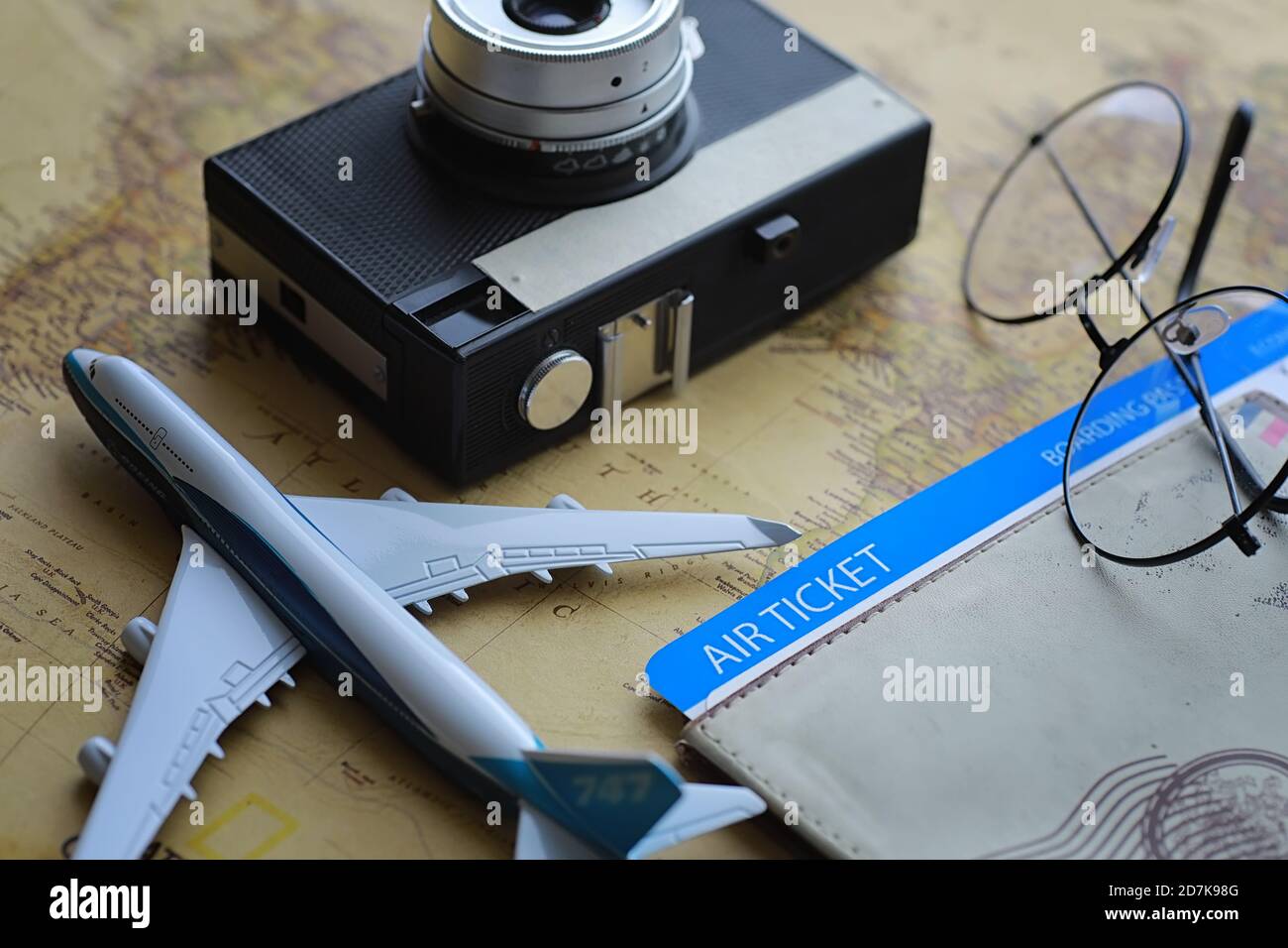 Travel concept. Map on the table andl aircraft Stock Photo - Alamy