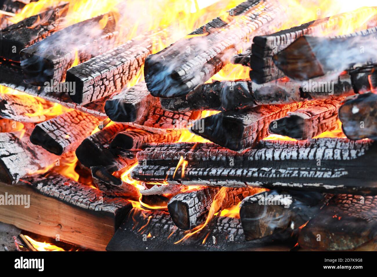 wooden logs burn with a bright flame in the fire Stock Photo - Alamy