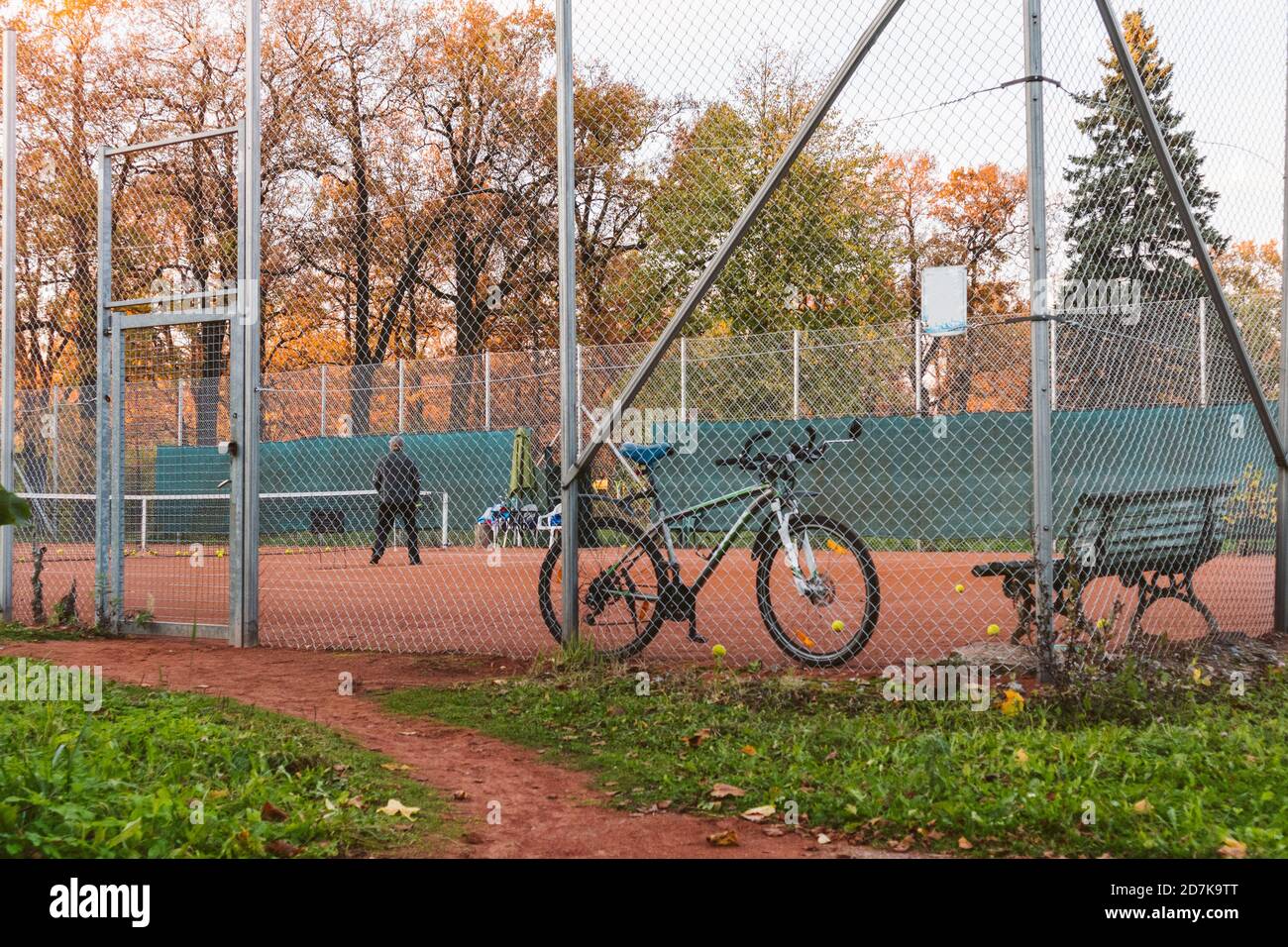 Mature man player in tennis court active lifestyle bike Stock Photo - Alamy