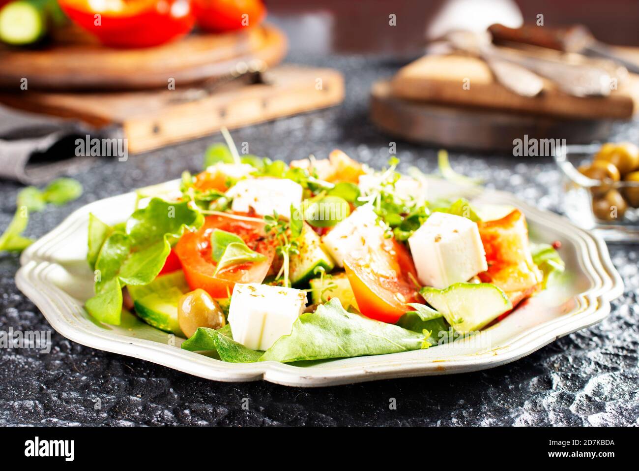 greek salad on metal plate, salad with feta cheese Stock Photo - Alamy