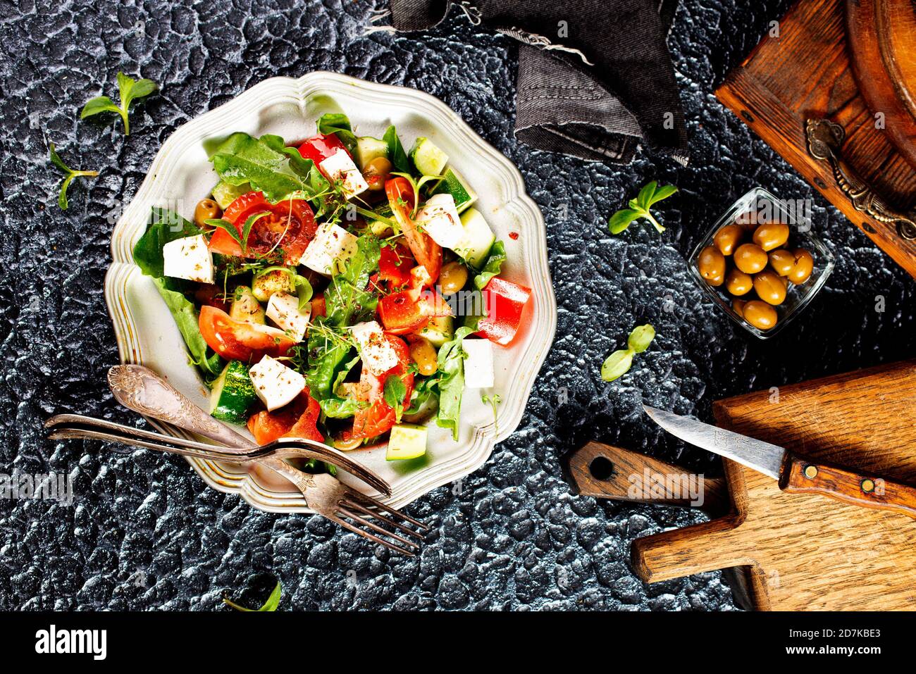 greek salad on metal plate, salad with feta cheese Stock Photo - Alamy