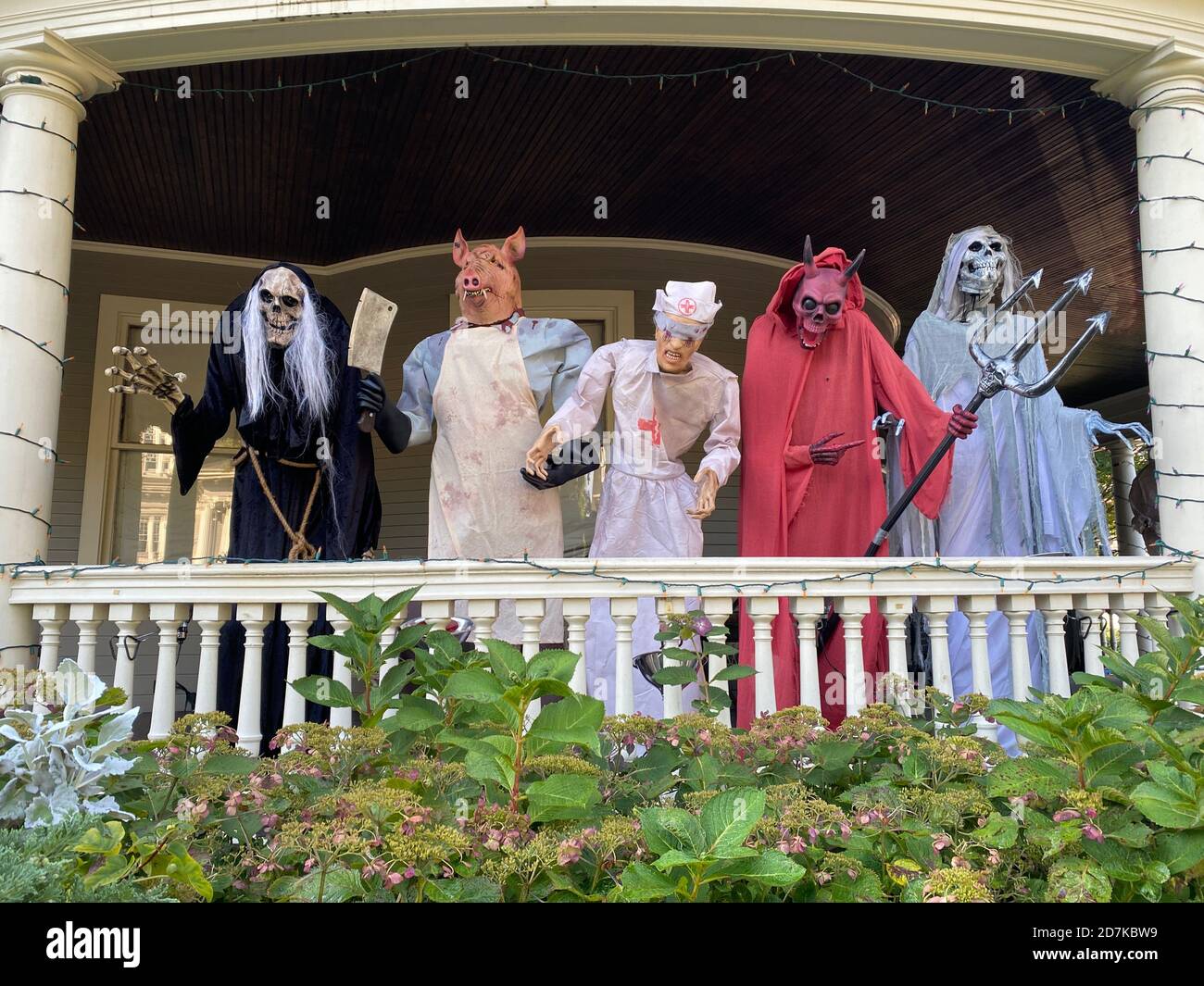 Scary Halloween installation on the porch of a large victorian house in ...