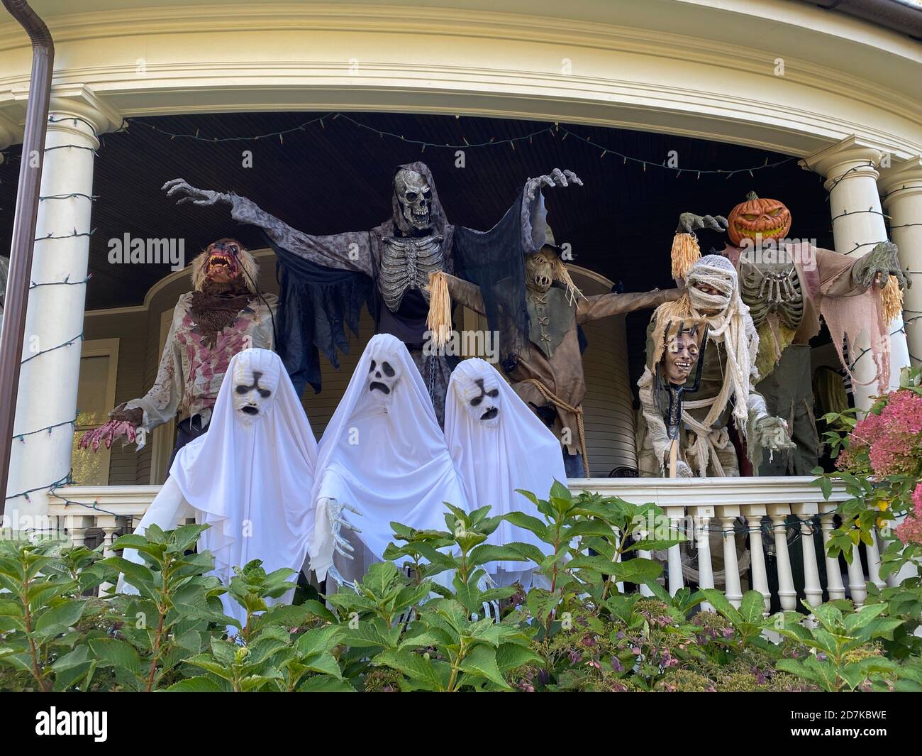 Scary Halloween installation on the porch of a large victorian house in ...