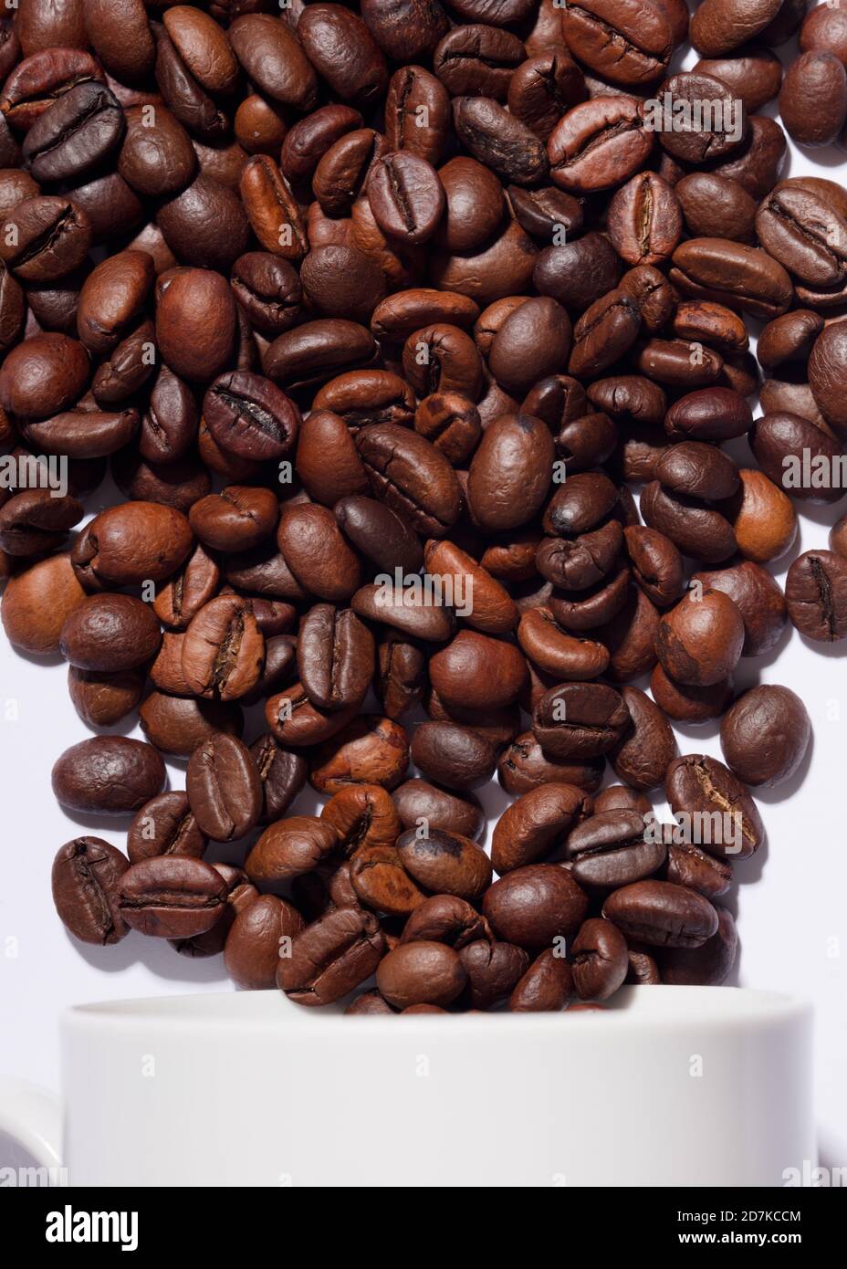 Isolated coffee beans (selective focus on coffee beans) with ceramic ...