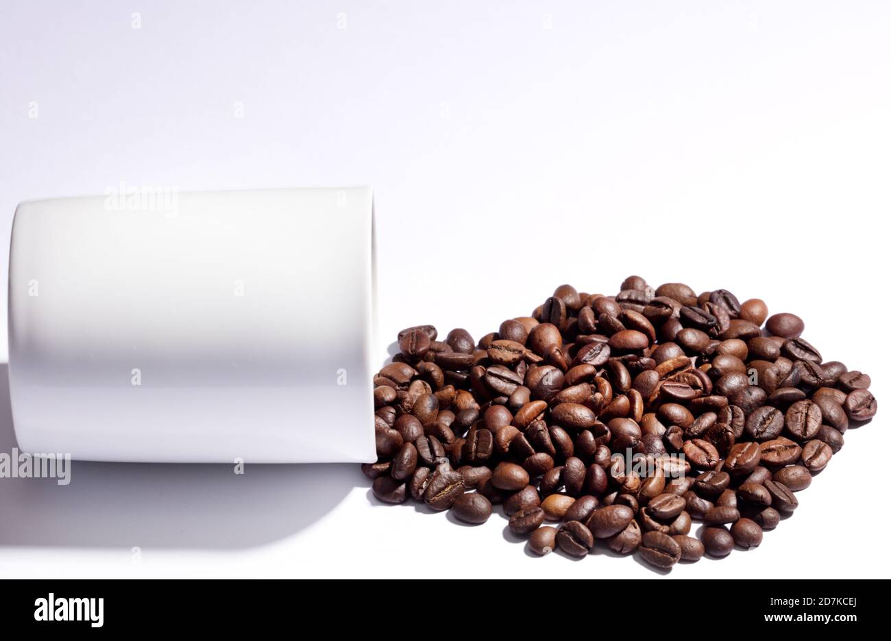 Isolated coffee beans (selective focus on coffee beans) with ceramic ...