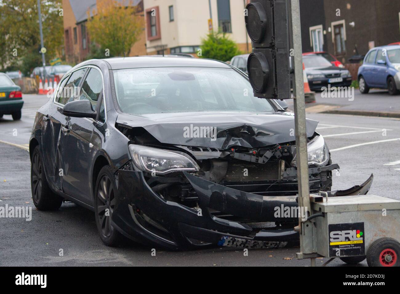 A crashed car next to temporary traffic light signals Stock Photo - Alamy