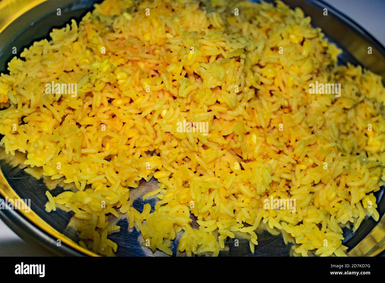 Yellow fried rice served on steel plate looking awesome Stock Photo - Alamy