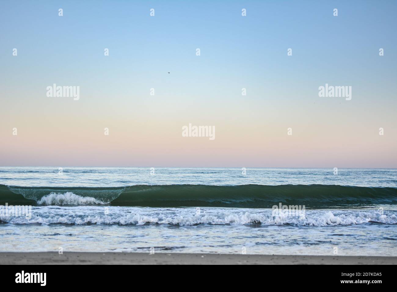Crest of a wave in the Black Sea at sunset, selective focus. Sea waves ...