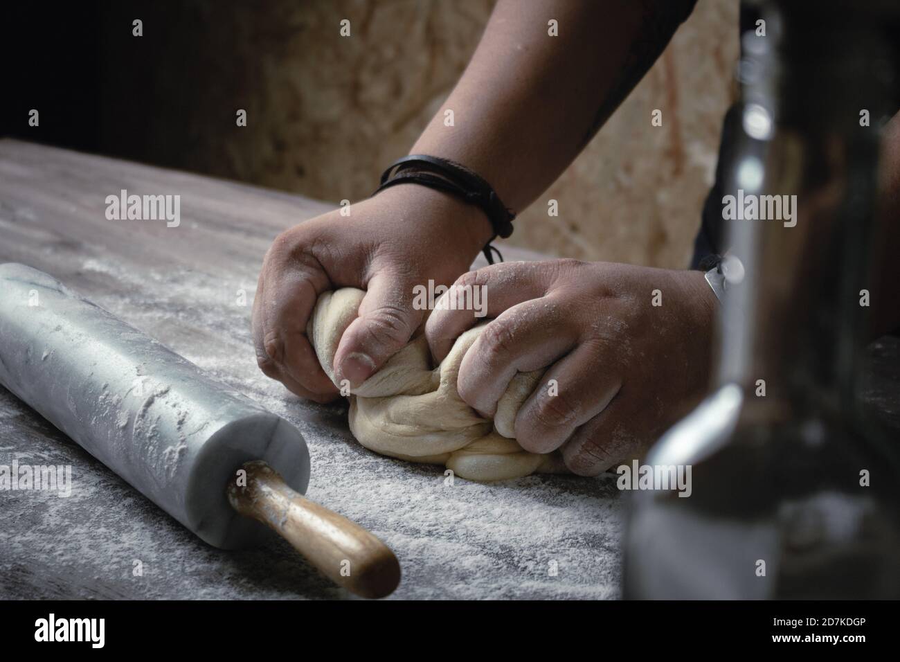 Closeup shot of a baker mixing the dough with flour Stock Photo - Alamy