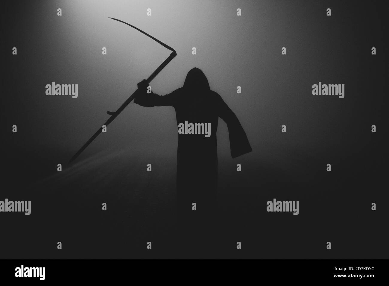 Death grim Reaper skeleton wearing a black robe and wielding a scythe ...