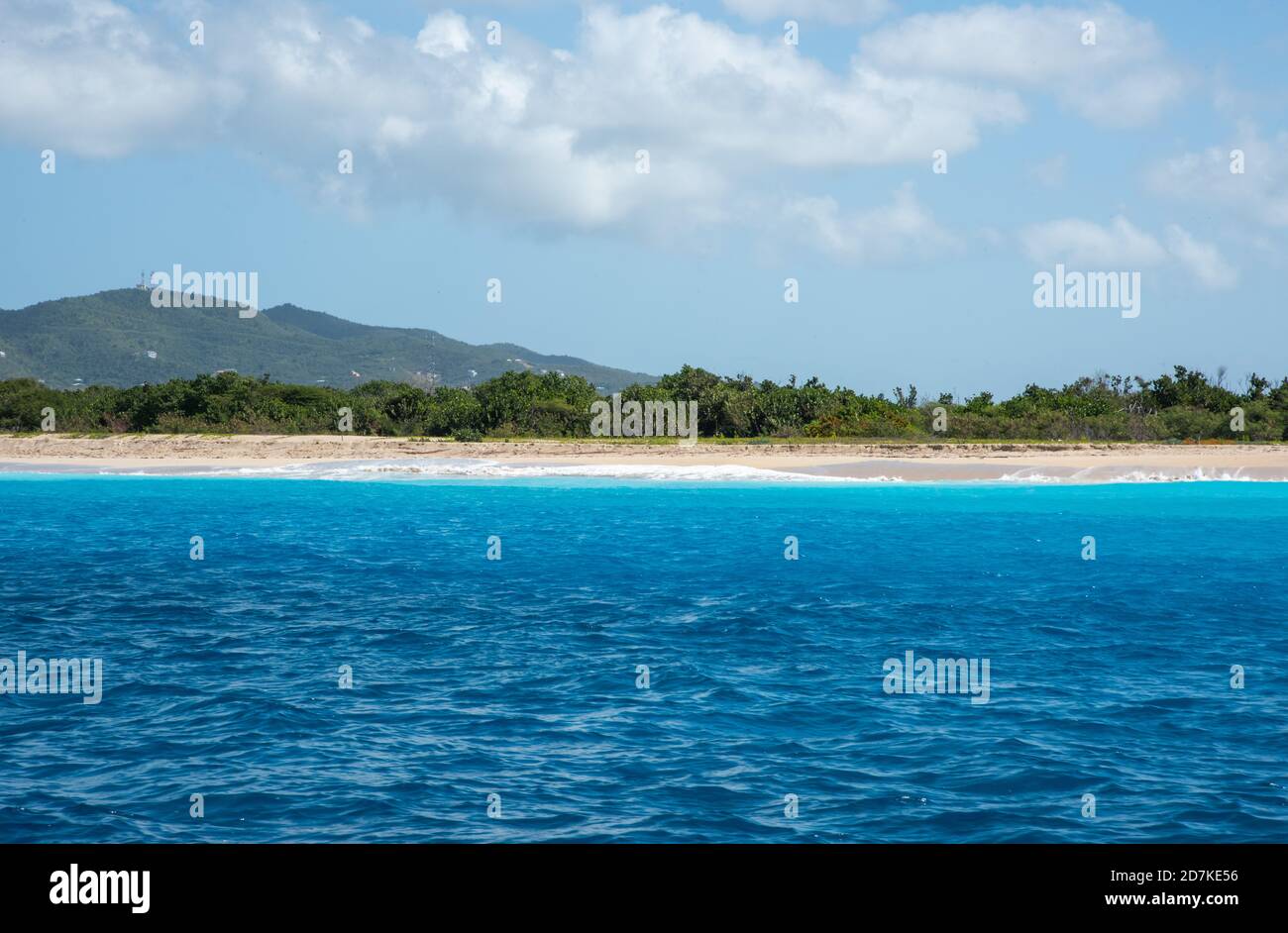 View into Sandy Point beach with rolling landscape and turquoise ...