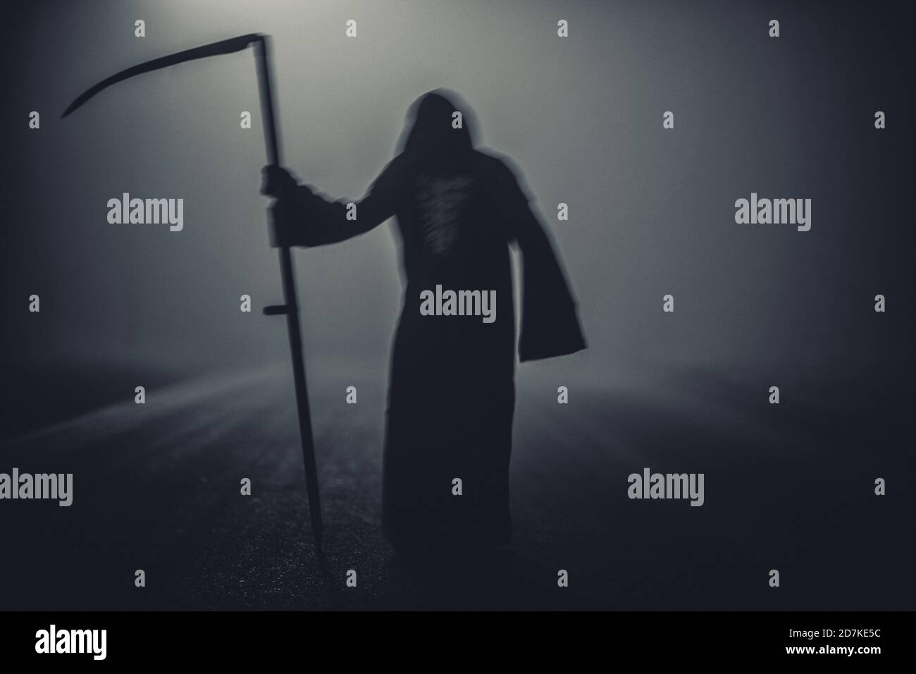 Death grim Reaper skeleton wearing a black robe and wielding a scythe ...