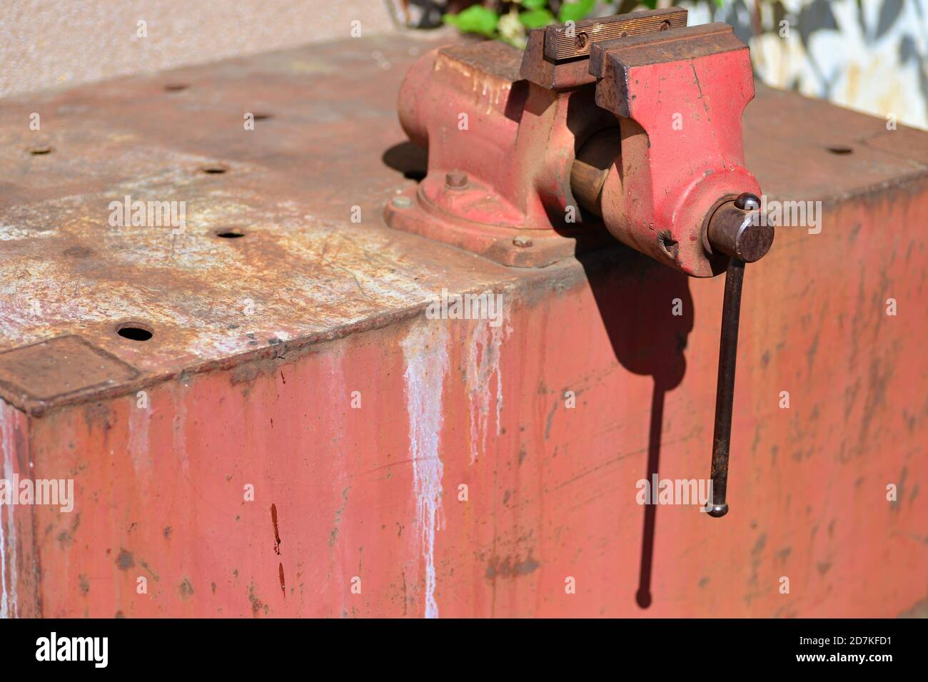 Vise on the steel table. Used mechanical machine. Old work table with a ...