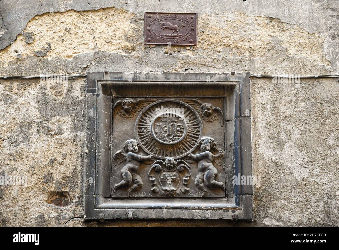 Bas-relief depicting the symbol IHS Greek acronym of the name Jesus ...