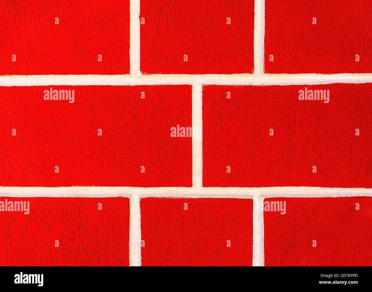 Bright red background with white seams. Wall surface. Building block ...