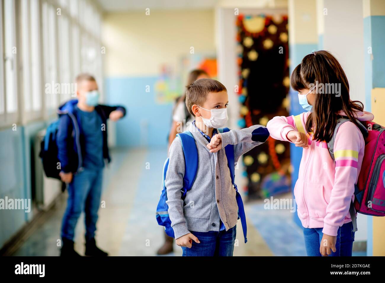 Elementary students greet with elbow bump Stock Photo - Alamy
