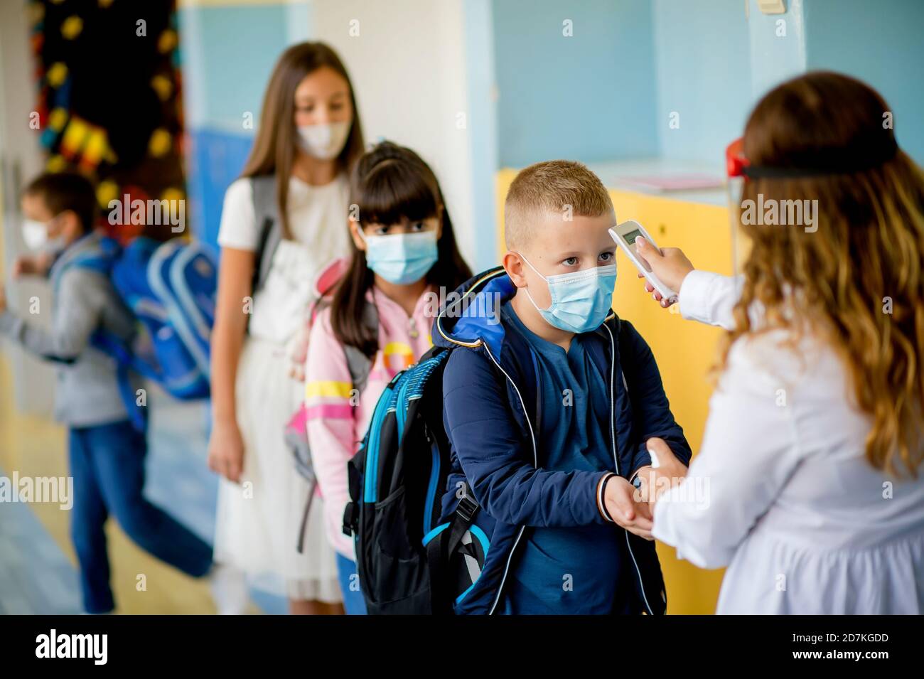 Teacher doing temperature check on school children Stock Photo - Alamy Teacher doing temperature check on school children Stock Photo - Alamy