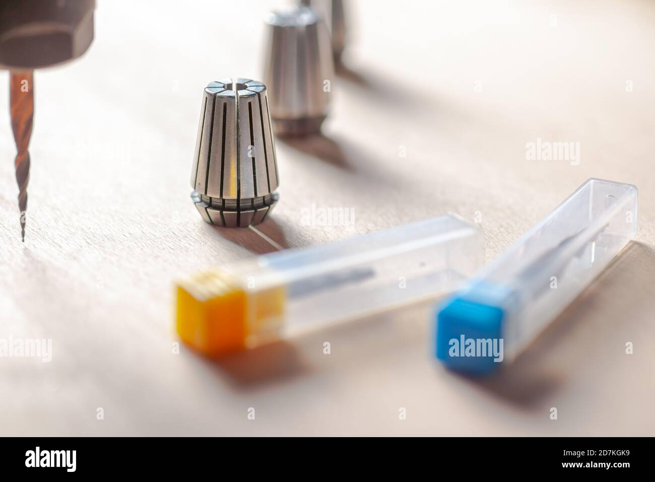 three collets of a cnc machine, two milling cutters in boxes, a spindle ...