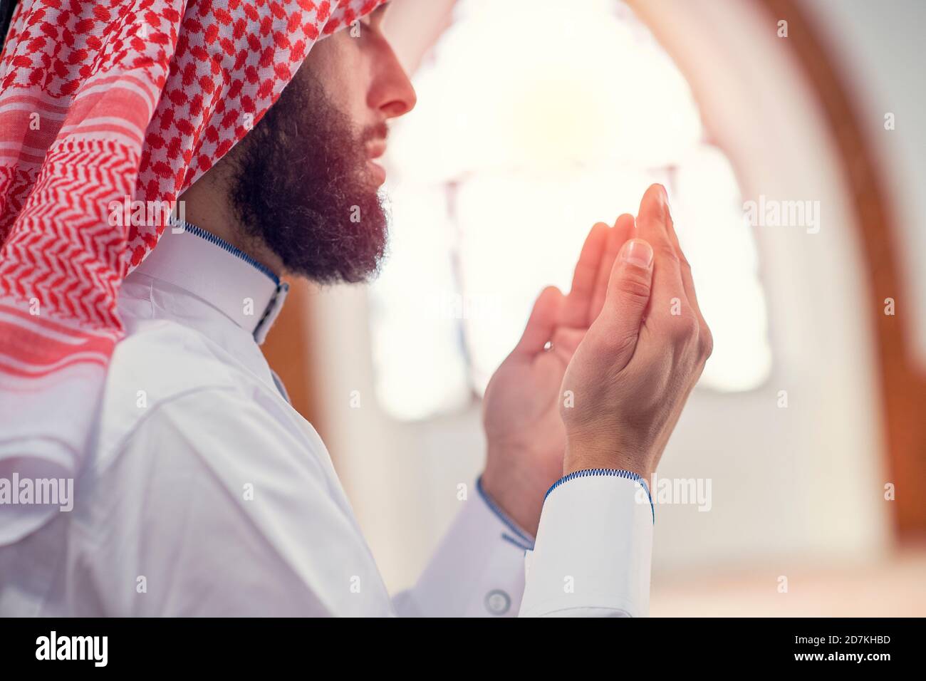 Religious arab muslim man reading holy quran Stock Photo - Alamy