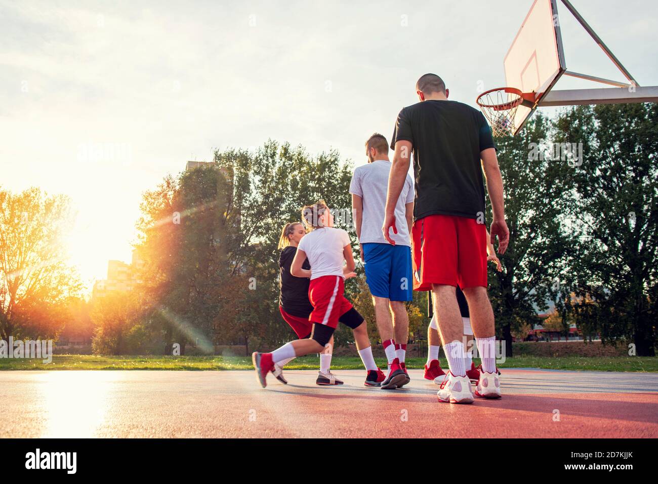 Group Of Young Friends Playing Basketball Match Stock Photo - Alamy
