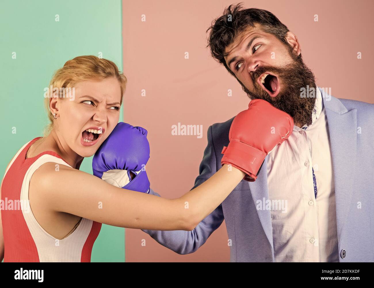 Boxers fighting in gloves. Domination concept. Gender equality. Man and ...