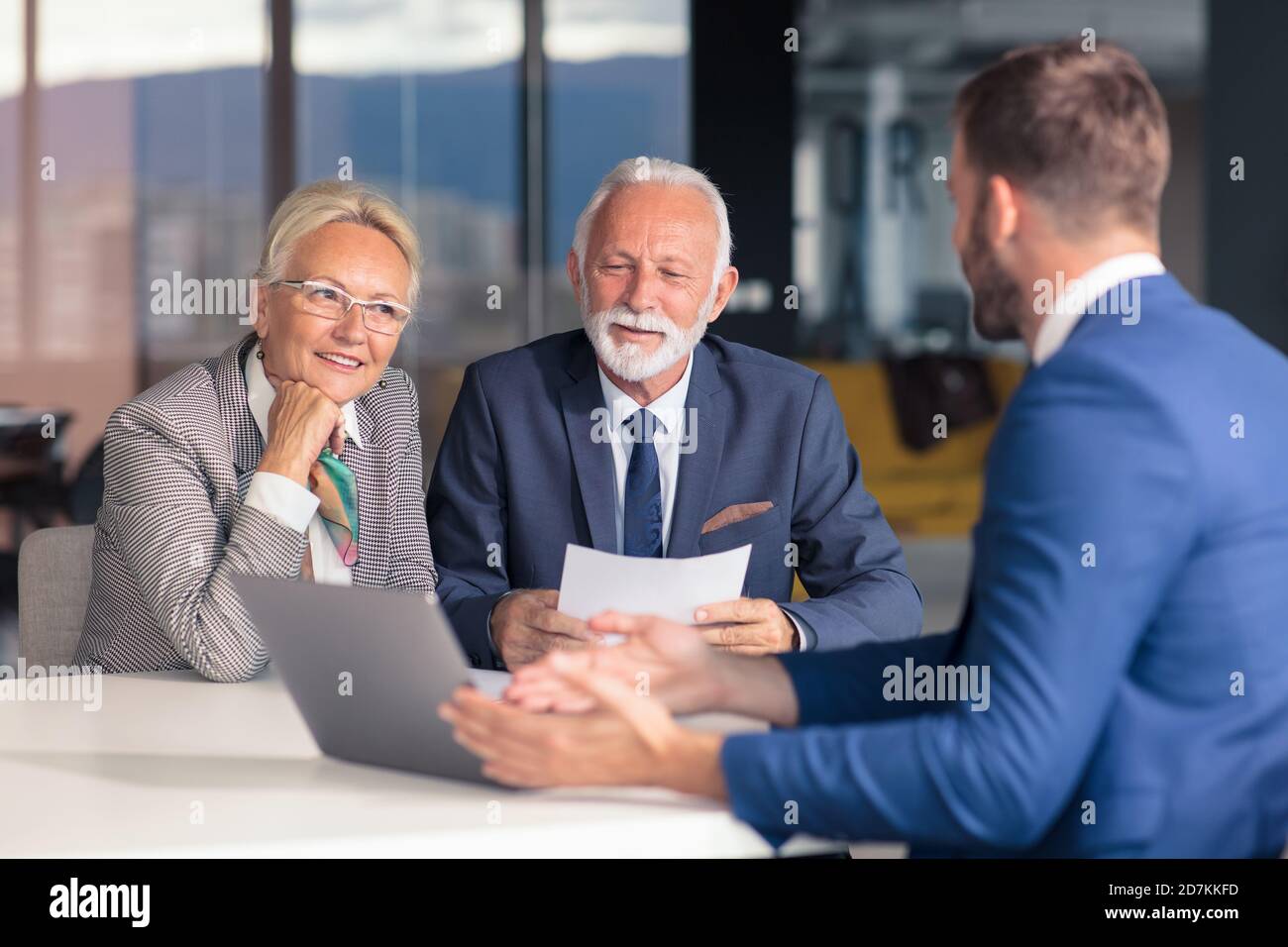 Insurance agent with aged couple hi-res stock photography and images ...
