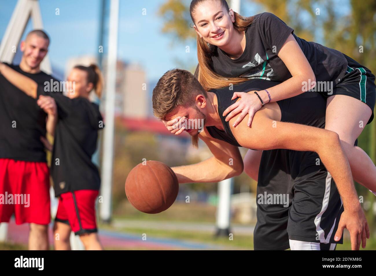 Group Of Young Friends Playing Basketball Match Stock Photo - Alamy