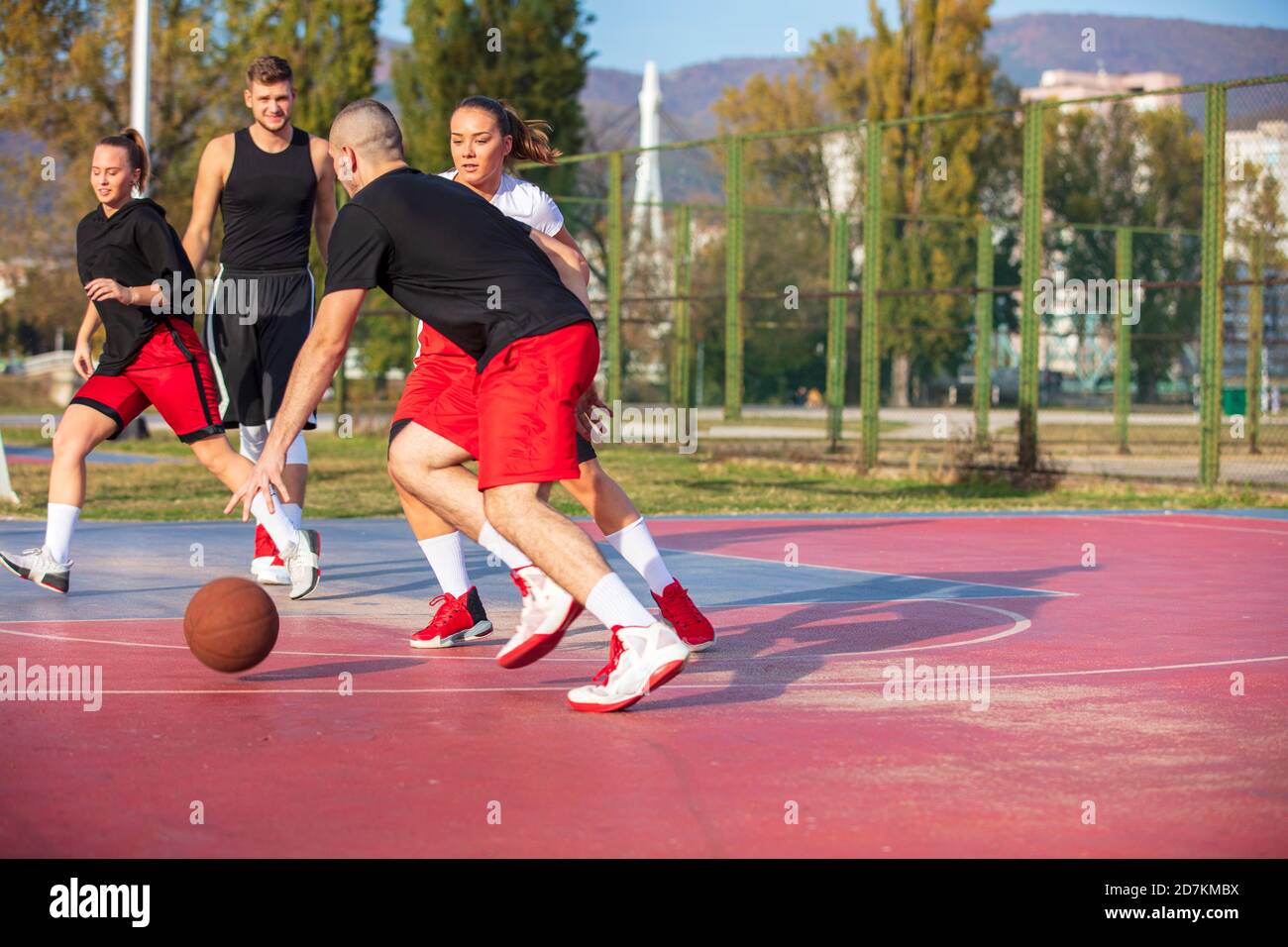 Group Of Young Friends Playing Basketball Match Stock Photo - Alamy