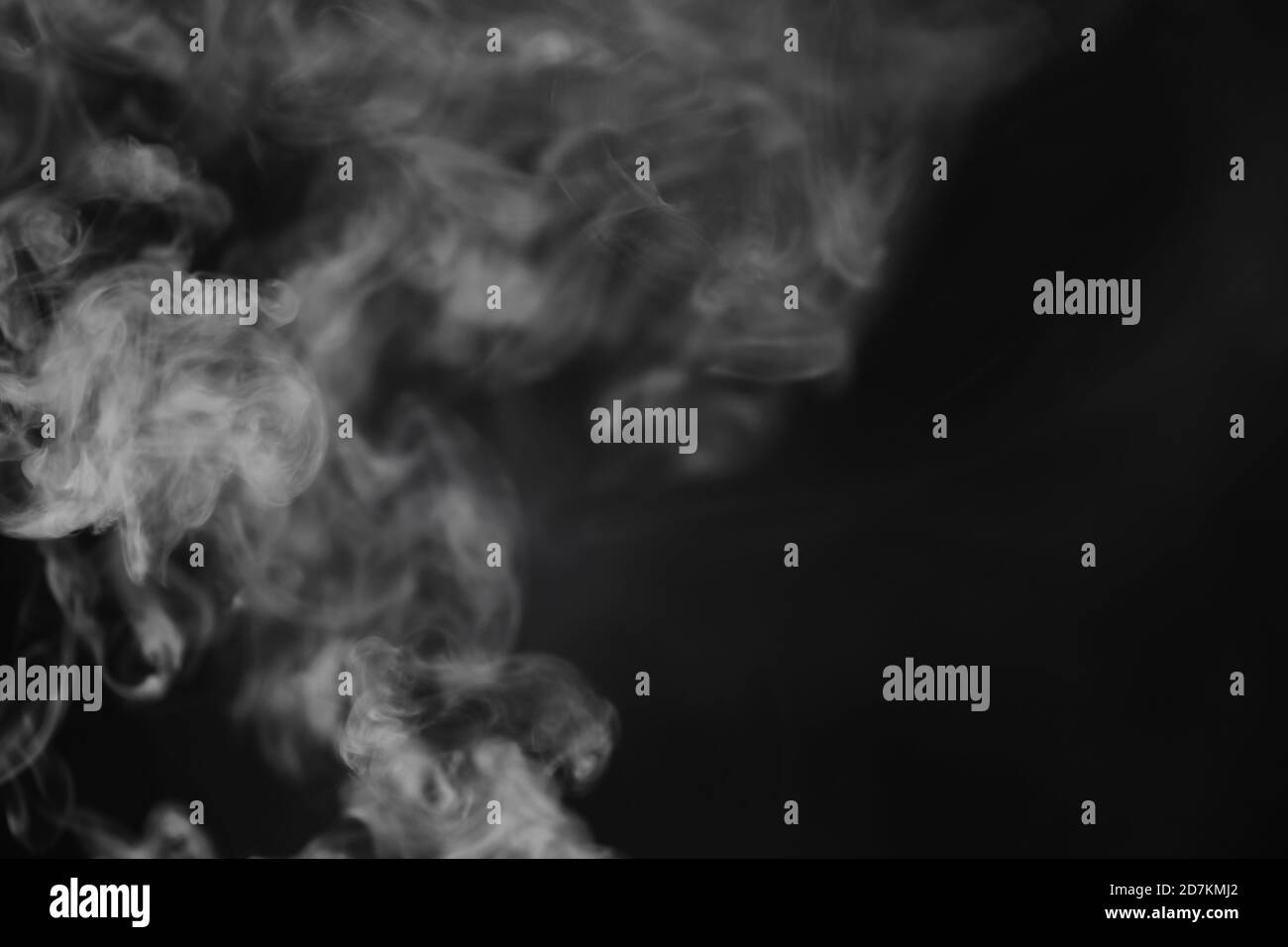 White smoke on a black background. Texture of smoke. Clubs of white ...