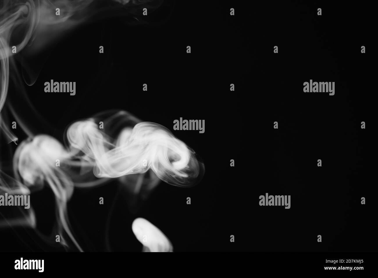 White smoke on a black background. Texture of smoke. Clubs of white ...