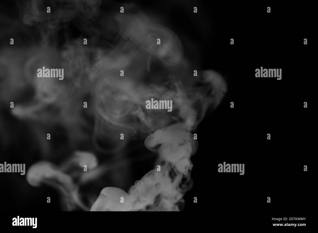 White smoke on a black background. Texture of smoke. Clubs of white ...