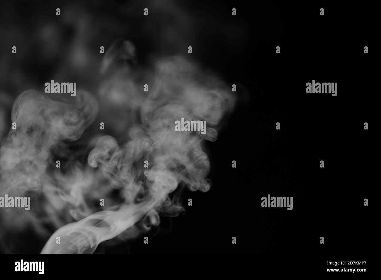 White smoke on a black background. Texture of smoke. Clubs of white ...