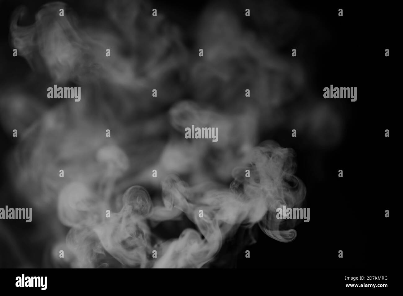 White smoke on a black background. Texture of smoke. Clubs of white ...