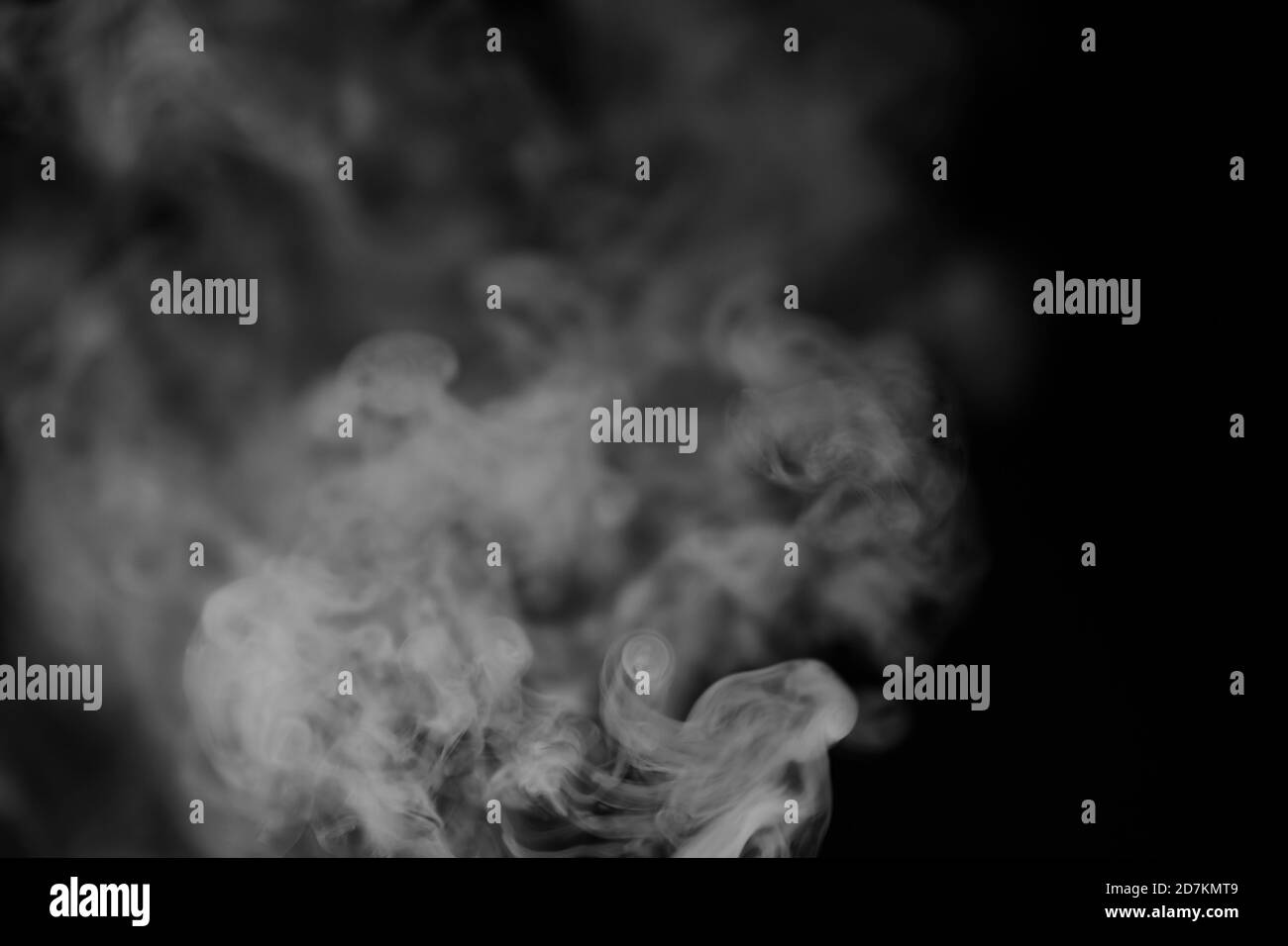White smoke on a black background. Texture of smoke. Clubs of white ...