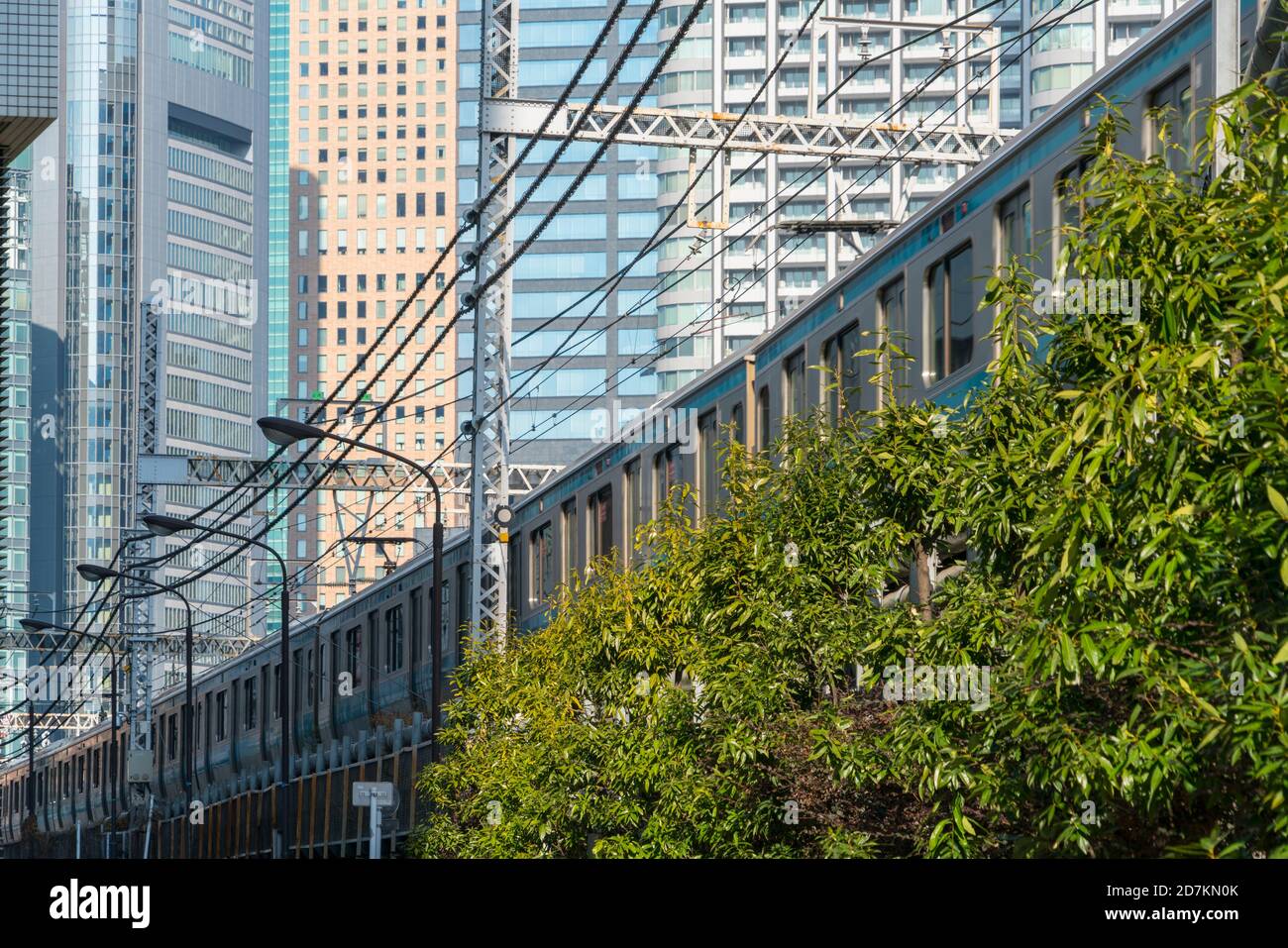 Row of high-rise buildings stands beyond the JR Tokyo Japan Stock Photo ...