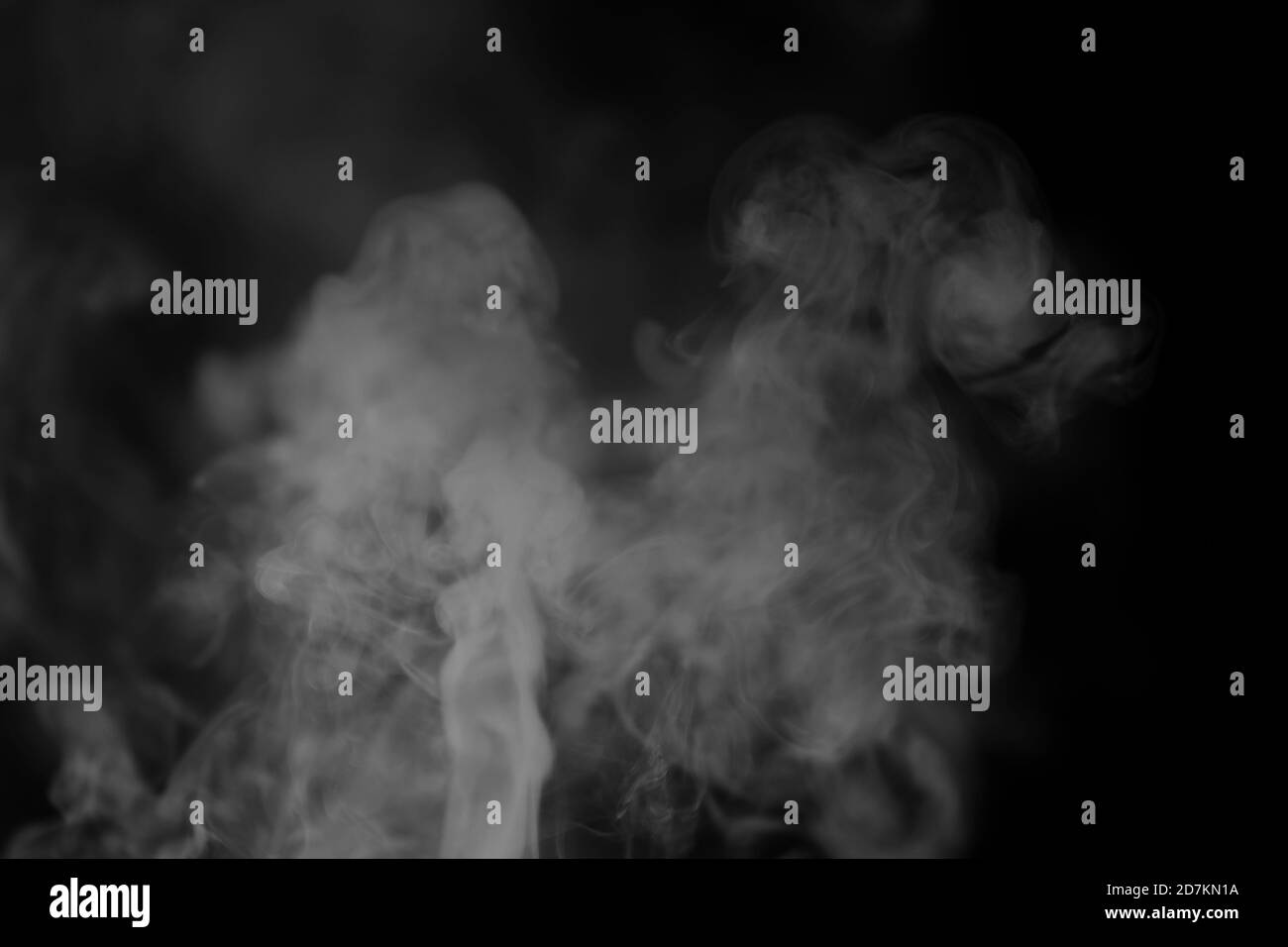 White smoke on a black background. Texture of smoke. Clubs of white ...