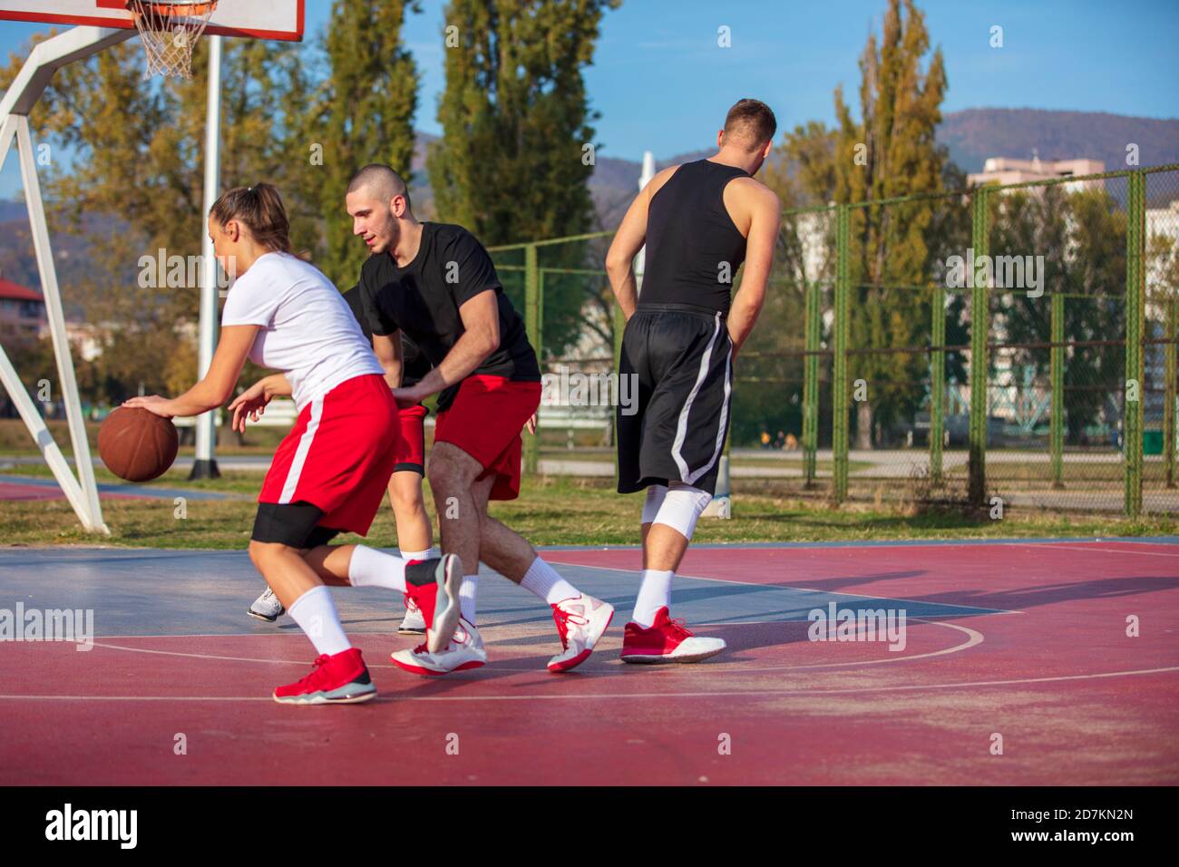 Group Of Young Friends Playing Basketball Match Stock Photo - Alamy